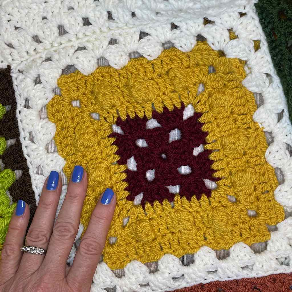 An easy crochet popcorn stitch granny square | MadameStitch